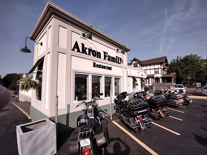 The colorful AKRON sign welcomes visitors with hometown pride, while spring tulips add a cheerful touch to this breakfast destination's curb appeal.