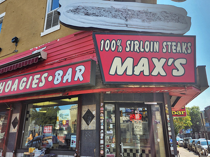 The iconic red storefront of Max's Steaks announces itself with all the subtlety of a boxing announcer. "100% SIRLOIN STEAKS" isn't just a sign&mdash;it's a promise.