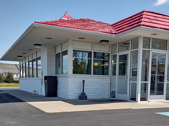 Mid-century modern meets comfort food heaven. The white-painted brick and gleaming windows promise delicious nostalgia inside.