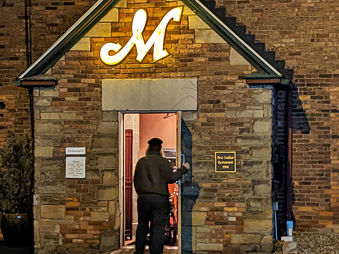 The iconic "M" glows like a beacon of culinary promise above Michaelangelo's rustic stone and brick exterior, Cleveland's answer to Tuscan charm.