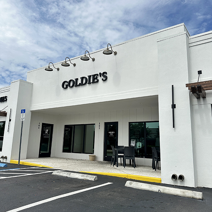 Goldie's clean white exterior promises no frills, just honest-to-goodness comfort food under Naples' blue skies.