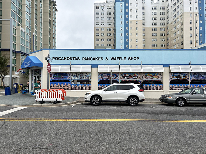 The iconic blue awning of Pocahontas Pancake House stands out against Virginia Beach's skyline, beckoning breakfast enthusiasts like a pancake lighthouse.