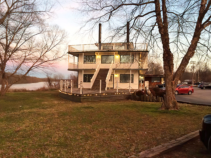 A riverboat that never sails but still takes you on a culinary voyage. Sunset casts a golden glow on this landlocked treasure.