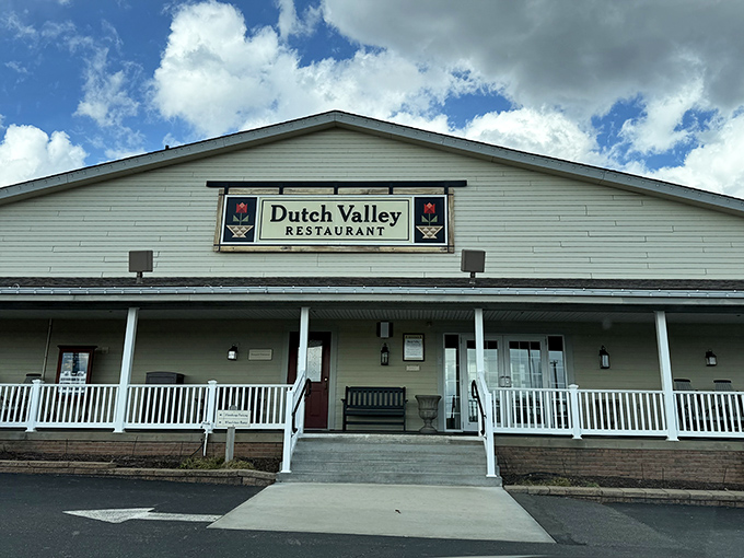 Welcome to paradise! Dutch Valley's inviting farmhouse exterior promises comfort food that'll make your cardiologist wince and your soul sing.