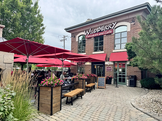 Outdoor dining under crimson umbrellas transforms breakfast into an al fresco affair. Morning sunshine and pancake aromas&mdash;what more could you want?