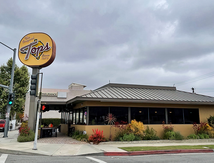 Where Pasadena history meets modern hunger. That circular sign has guided generations of locals to burger bliss since the 1950s.