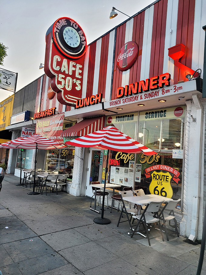 The red and white striped façade of Cafe 50's beckons like a time machine disguised as a diner. Route 66 nostalgia meets Los Angeles cool.