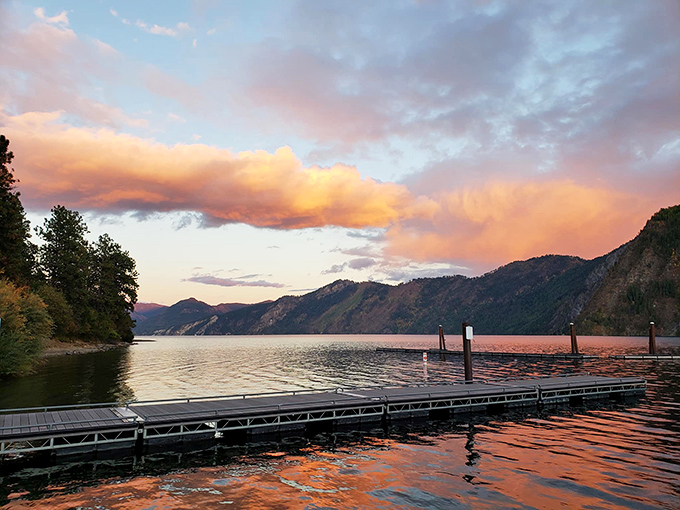 Sunset paints Lake Pend Oreille in Hollywood-worthy hues, turning an ordinary dock into front-row seats for nature's nightly show.
