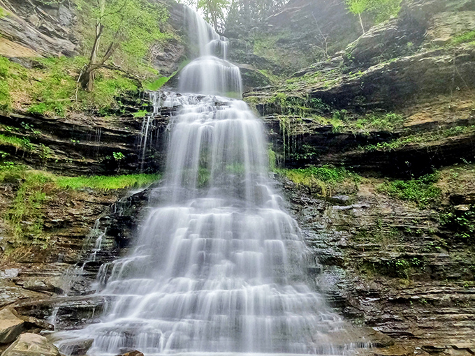 Nature's tiered masterpiece puts on a show as Cathedral Falls cascades down layered rock formations, creating a mesmerizing staircase of tumbling water.