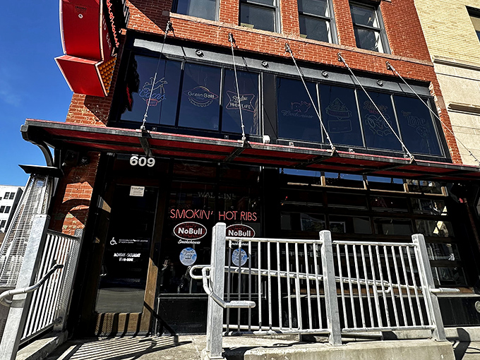 The historic brick fa&ccedil;ade of NoBull Smokehouse stands as a beacon of barbecue hope on Fargo's NP Avenue, promising smoky delights within those hallowed walls.