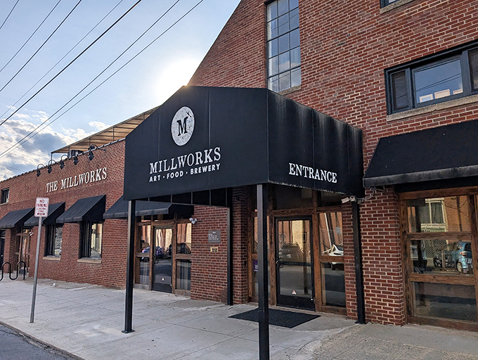 The brick facade of The Millworks stands like a culinary fortress in Harrisburg, promising delicious adventures within its historic walls.