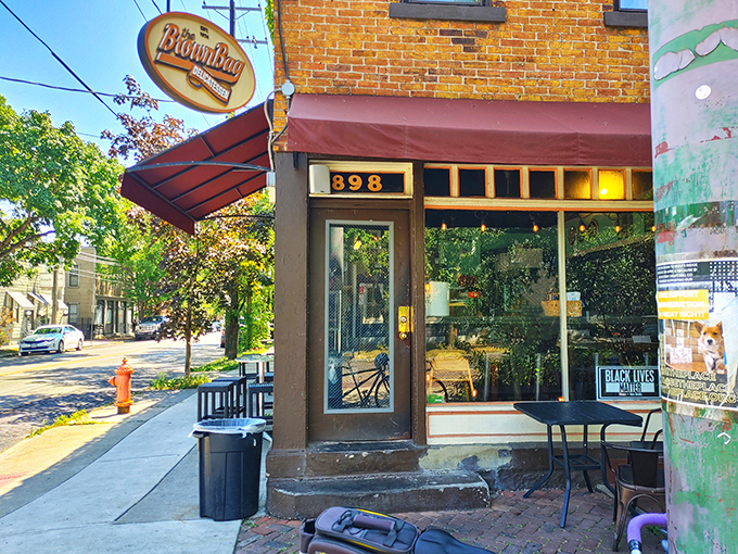 That iconic burgundy awning and vintage sign beckon hungry passersby like a lighthouse for the lunch-starved sailors of Columbus.