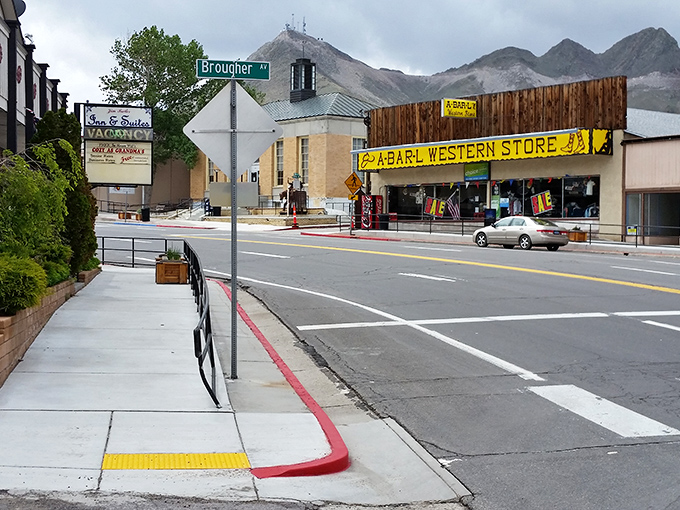 Main Street charm with a side of mountain majesty. A-Earl Western Store stands ready to outfit you for desert adventures while the mountains keep watch.