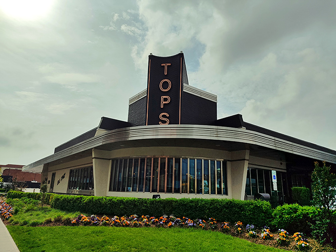 The iconic Tops Diner exterior stands proudly against the New Jersey sky, its mid-century modern architecture promising culinary treasures within.