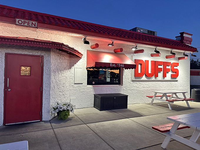 The iconic white building with bold red "DUFFS" signage stands like a beacon for wing pilgrims. Simple exterior, extraordinary flavors within.