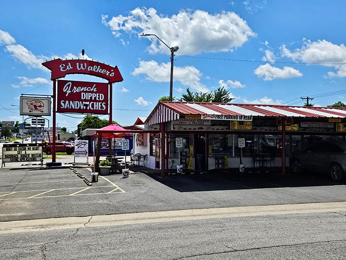 The iconic red and white striped awning of Ed Walker's stands like a beacon for hungry travelers, promising French-dipped salvation on Towson Avenue.