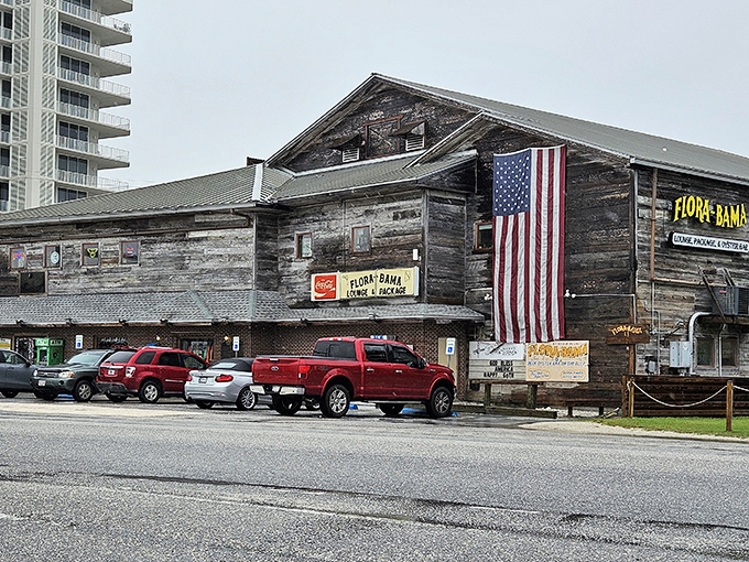 Where Florida meets Alabama, this roadside landmark announces itself with patriotic flair and the promise of cold drinks just steps from the Gulf.