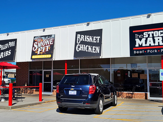 The unassuming storefront speaks the universal language of barbecue: bold signage that promises smoky delights within. No fancy frills needed.