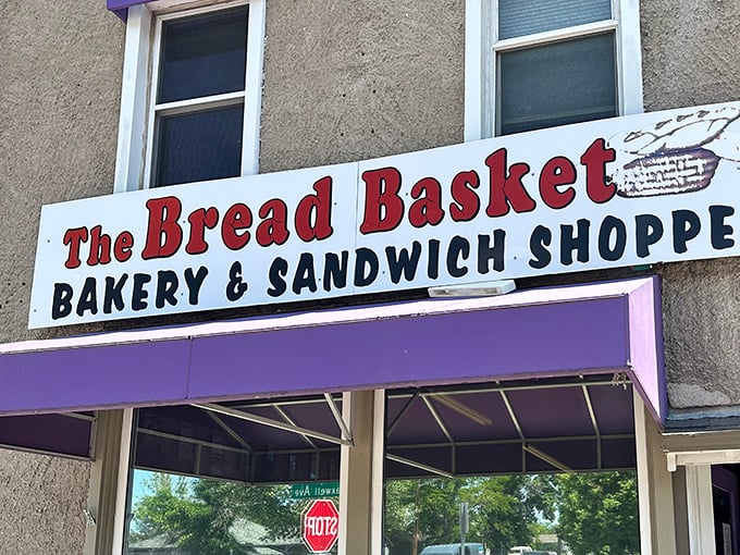 That purple awning is your beacon of hope in a world of mediocre baked goods and broken dreams.