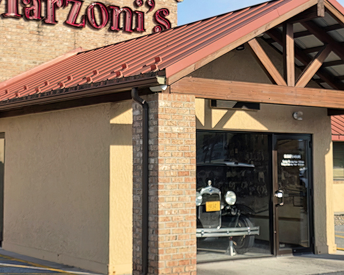Marzoni's exterior welcomes you with rustic charm and that signature red roof, like a beacon calling hungry travelers home.