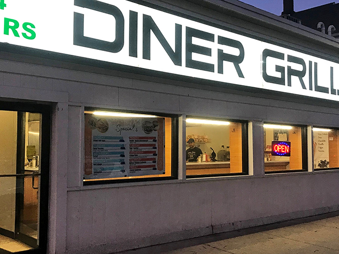 The neon glow of Diner Grill at night beckons like a lighthouse for the hungry, promising salvation in the form of perfectly cooked eggs and endless coffee.