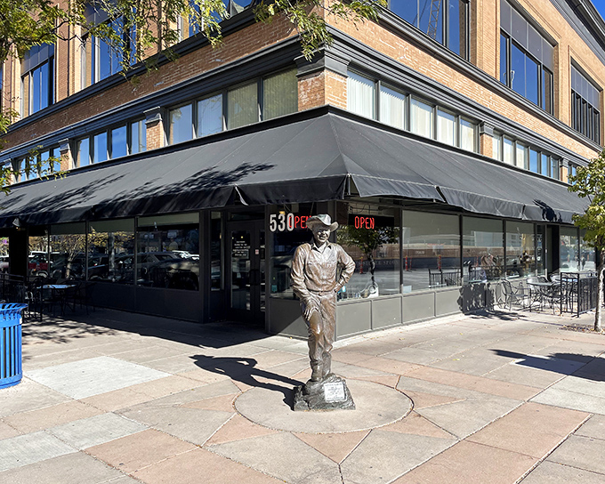 Downtown Rapid City's culinary cornerstone sports a classic black awning and welcoming facade that whispers, "Yes, the food inside is every bit as good as you've heard.".