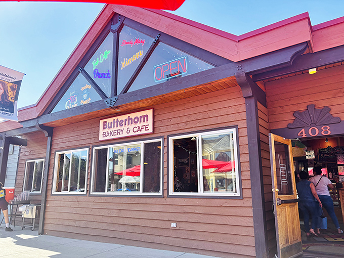 The wooden facade of Butterhorn Bakery & Cafe beckons like a cozy cabin promising breakfast nirvana, complete with that glowing "OPEN" sign that feels like permission to indulge.