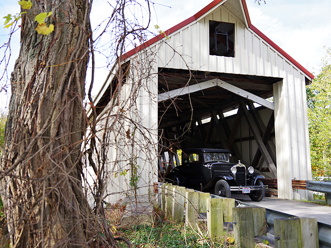 A vintage automobile passes through history&mdash;these wooden beams have witnessed the evolution from horse-drawn carriages to modern vehicles.