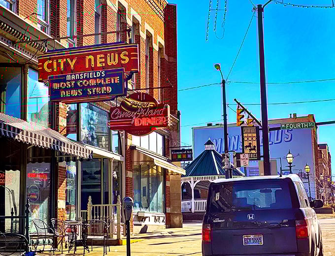 The iconic neon sign beckons like a lighthouse for hungry souls navigating downtown Mansfield. Some treasures don't need fancy packaging.