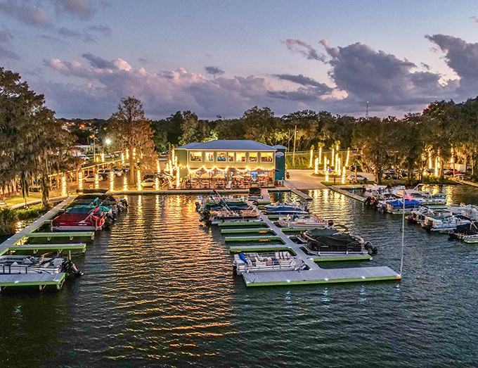 The marina comes alive at twilight, boats gently bobbing while string lights create a scene straight out of a romantic comedy's "fall in love here" moment.