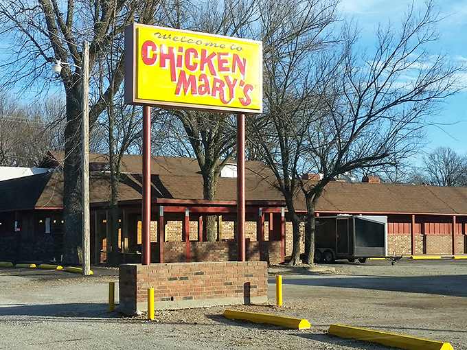 The bright yellow "Welcome to Chicken Mary's" sign stands like a beacon of hope for hungry travelers on the Kansas prairie