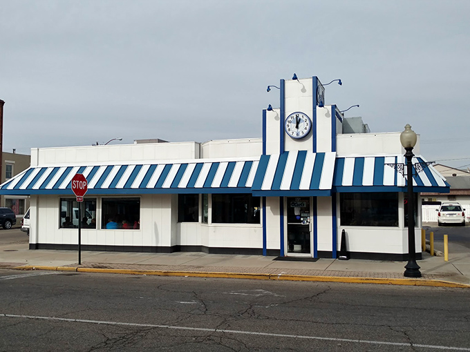 The iconic blue and white striped awning of Carl's Townhouse stands as a beacon of burger hope in downtown Chillicothe since 1939.