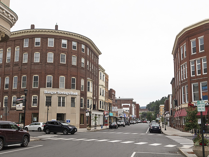 Downtown Rumford greets visitors with its curved brick architecture and small-town charm, where two-hour parking feels like an invitation rather than a limitation.