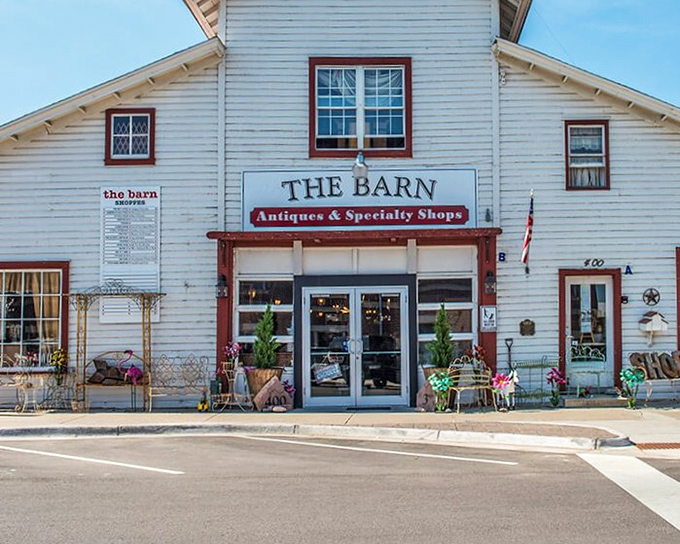 The white clapboard exterior with its classic red trim isn't just inviting&mdash;it's practically daring you to discover what treasures await inside.