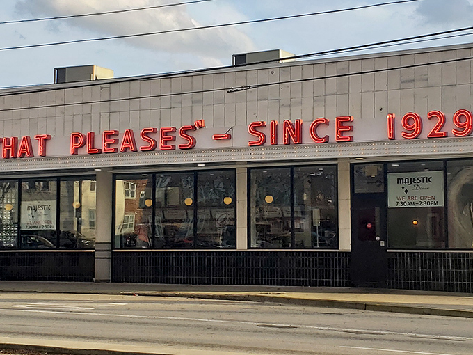The neon promise that's been lighting up Ponce since 1929 – "Food that pleases" isn't just a slogan, it's a time-tested guarantee.