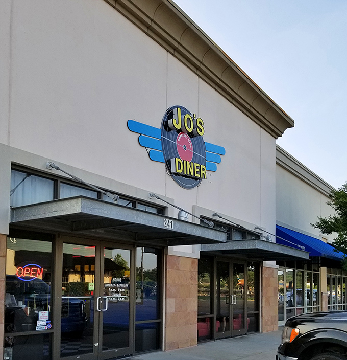 The retro vinyl record sign at Jo's Diner beckons like a time machine disguised as a restaurant. Classic Americana at its finest in Flowood.