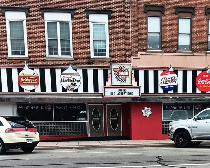 Like a time machine disguised as a storefront, Mom's Diner's exterior showcases those iconic vintage soda advertisements that instantly transport you back to simpler times.