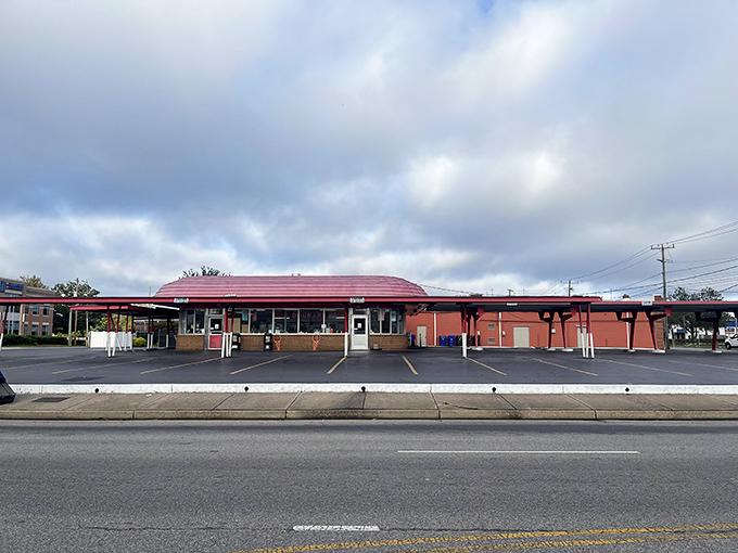 The classic red-roofed silhouette of Doumar's stands like a time capsule on Monticello Avenue, beckoning hungry travelers with promises of nostalgia and satisfaction.
