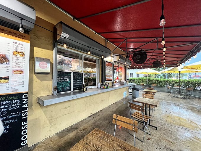 The red awning beckons like a culinary lighthouse on Biscayne Boulevard. Simple, unpretentious, and promising more satisfaction than most five-star establishments.