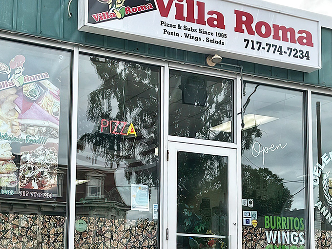 The unassuming storefront with its classic neon "BEST PIZZA IN TOWN" sign isn't just making empty promises&mdash;it's a time portal to pizza perfection.