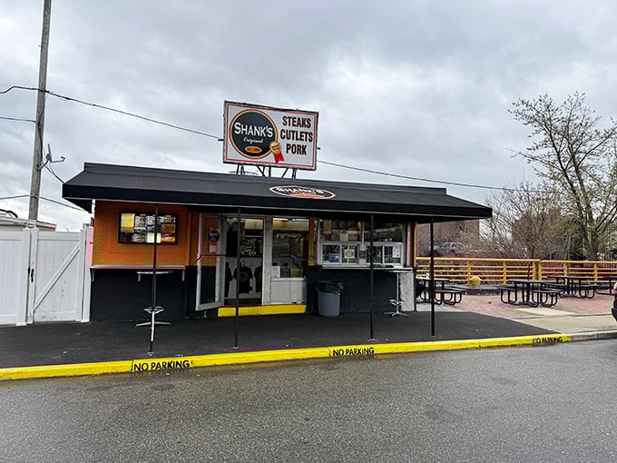 The unassuming exterior of Shank's Original stands like a temple to Philadelphia's sandwich gods, promising culinary transcendence beneath that iconic black awning.