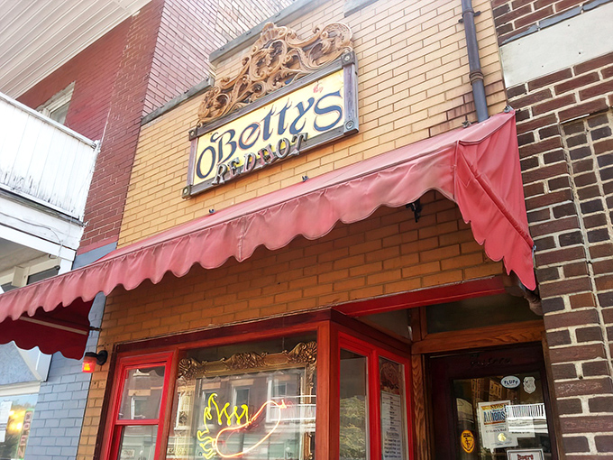 The iconic red awning of O'Betty's beckons like a beacon to hot dog aficionados. This unassuming storefront houses Athens' most celebrated frankfurter sanctuary.