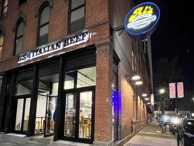 The iconic blue and yellow sign beckons hungry Chicagoans like a lighthouse for beef lovers. Al's brick facade has witnessed decades of culinary pilgrimages.