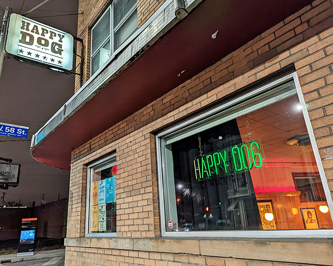 The unassuming brick exterior of Happy Dog stands like a culinary speakeasy in Cleveland's Gordon Square, its vintage sign promising simple pleasures done right.