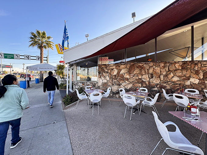 The iconic angular roof of Pann's welcomes you like an old friend, with outdoor seating that whispers, "Stay awhile, the pancakes are worth it."