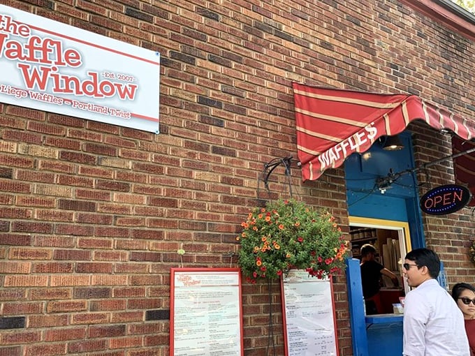 The iconic blue window with its cheerful red awning isn't just an entrance&mdash;it's a portal to waffle paradise that's worth every minute in line.