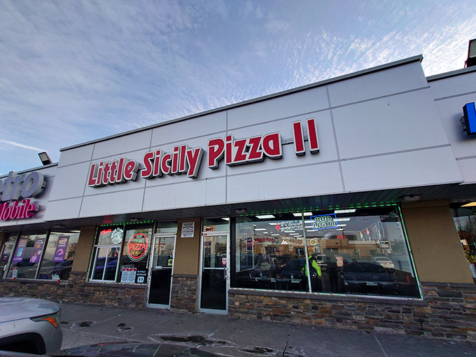 The unassuming storefront of Little Sicily Pizza II, where culinary magic happens behind that simple red signage and stone facade.