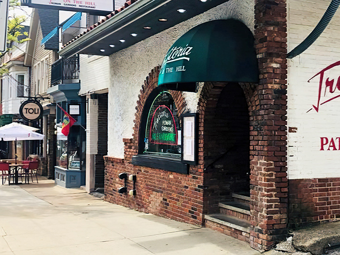 The terra cotta roof and brick facade of Trattoria Roman Garden isn't just charming&mdash;it's a Little Italy landmark that promises culinary magic within.