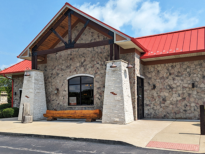 The stone fortress of flavor stands proudly in Montgomery, its red roof a beacon to hungry travelers seeking burger nirvana.