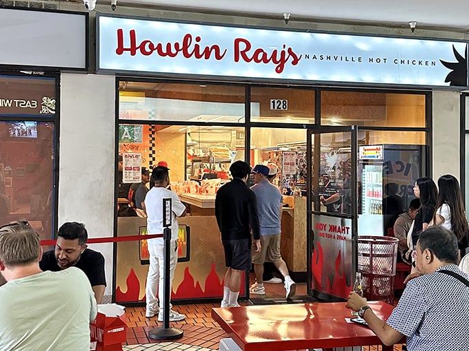 The pilgrimage begins here: Howlin' Ray's storefront in Chinatown's Far East Plaza, where the line forms early and the anticipation builds with every step closer.
